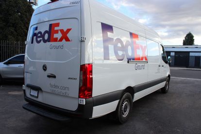 FedEx ground car wrap with opaque vinyl lettering | Front Signs