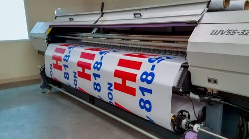 Printing process of a large advertising banner | Front Signs