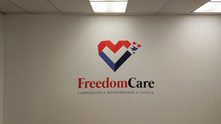 Freedom Care interior branding with wall decal | Front Signs