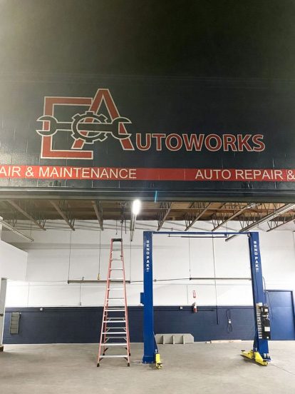 EA Autoworks storefront painted logo sign | Front Signs