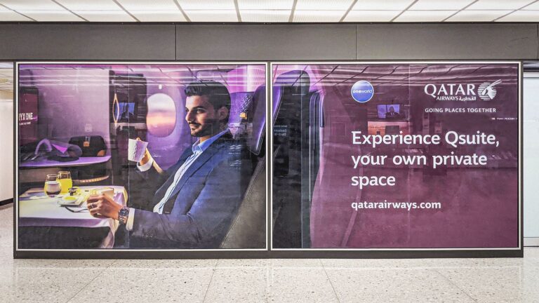 Qatar Airways promotional decals at Dulles Airport | Front Signs