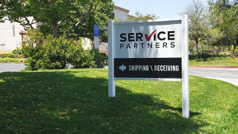 Service Partners double-sided directional sign | Front Signs