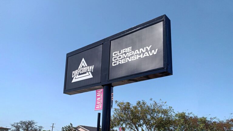 Cure Company pylon sign face replacement | Front Signs