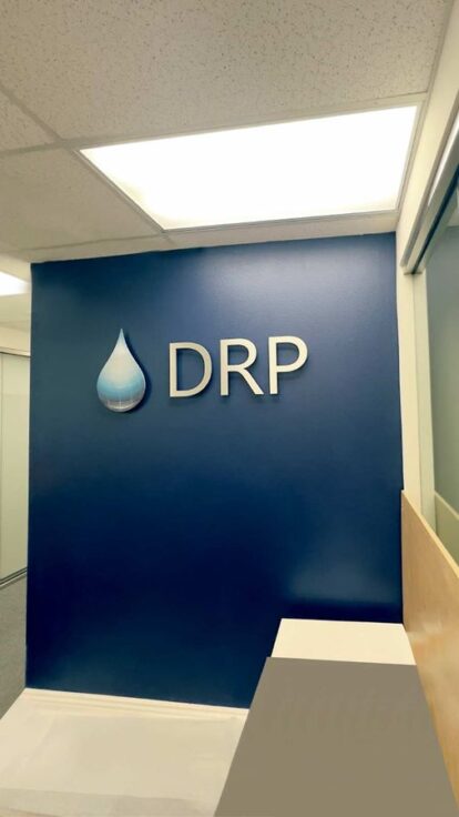 DRP Engeneering aluminum sign attached to the wall | Front Signs