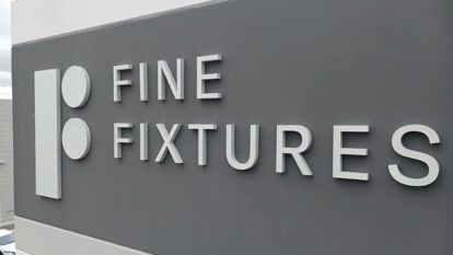 Fine Fixtures high rise sign installation | Front Signs