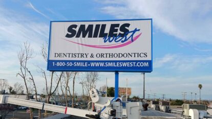 Smiles West outdoor sign face replacement | Front Signs