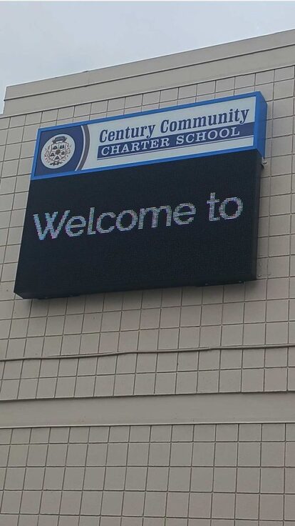 Prominent outdoor sign installation on the facade | Front Signs