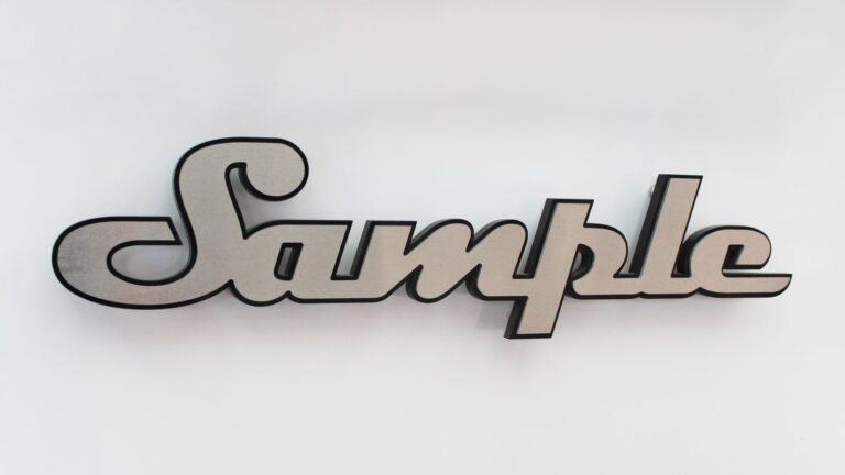 A sample of Brushed Aluminum Sign for a showroom | Front Signs
