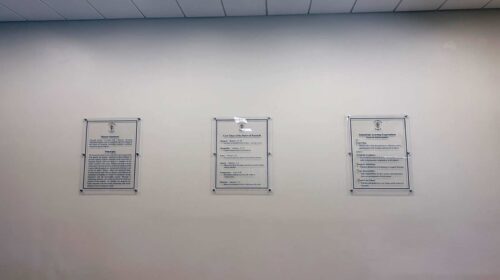 Acrylic signs attached to the interior wall | Front Signs