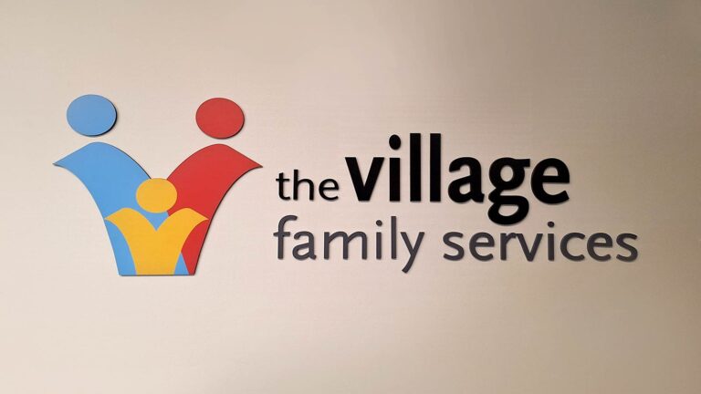 The Village Family Services wall signage for branding | Front Signs