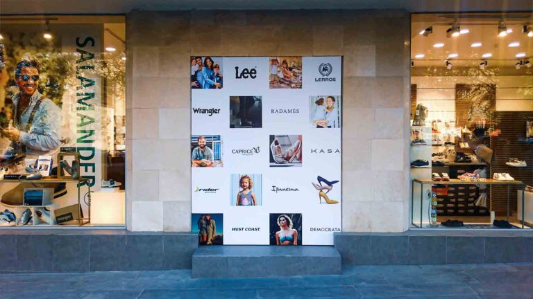 Corporate vinyl banner for a clothing store | Front Signs