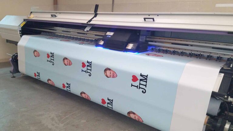 Wide format printing of a personalized vinyl banner | Front Signs
